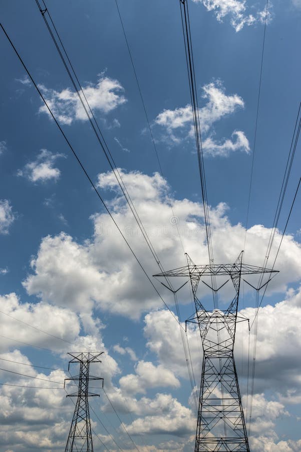 Vertical Power Lines with White Puffy Clouds Stock Image - Image of ...