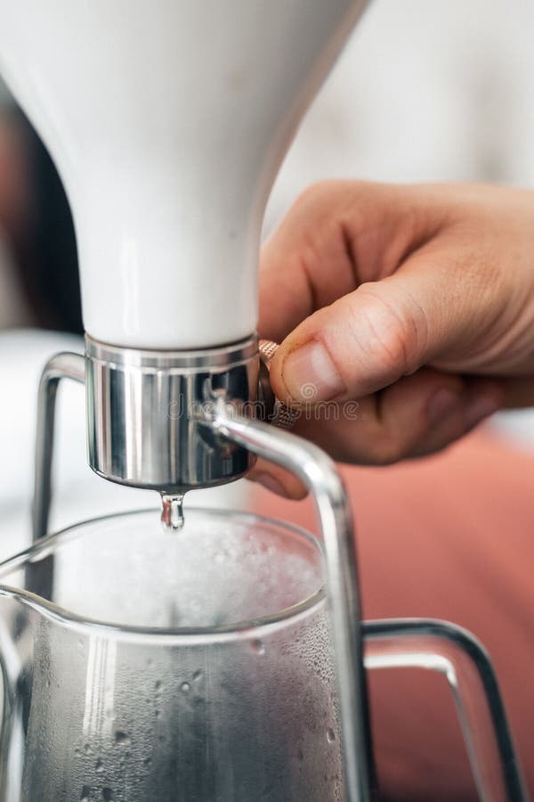 Vertical Shot of a Process of Making an Expresso Coffee with Hands and ...