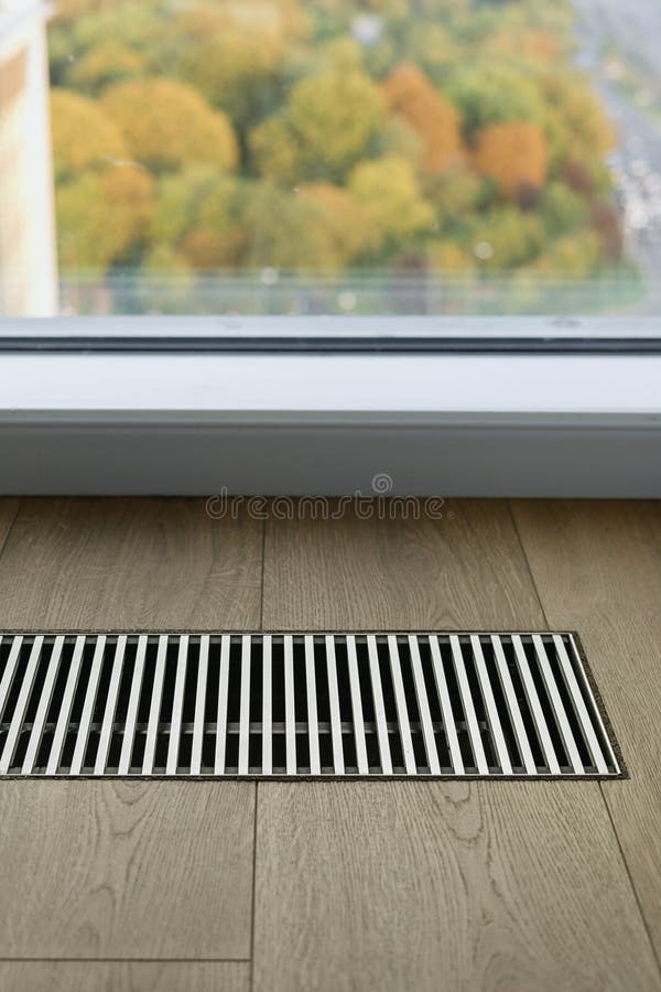 Vertical Shot of Protective Radiator Grille Built-in into the Floor for ...