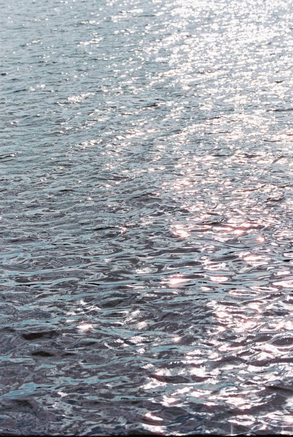 Vertical Shot of a Pure Water Surface Under Sunlight Stock Photo ...