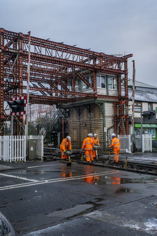 Vertical Shot of Railway Workers Working on a Level Crossing in Bamber ...