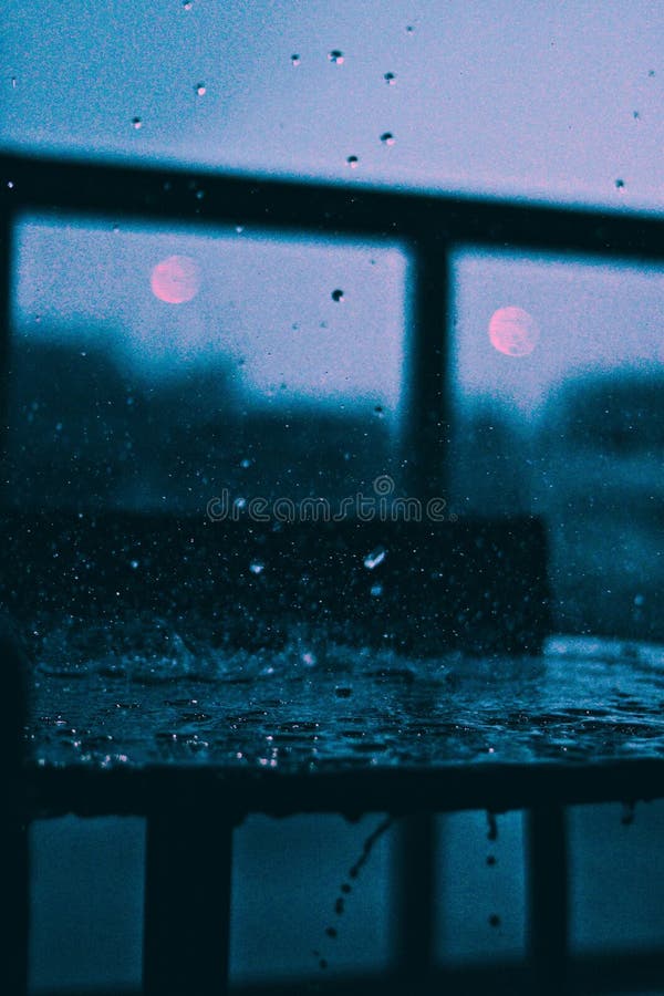 Vertical Shot of Raindrops on a Dark Background Stock Photo - Image of ... Vertical Shot of Raindrops on a Dark Background Stock Photo - Image of ...