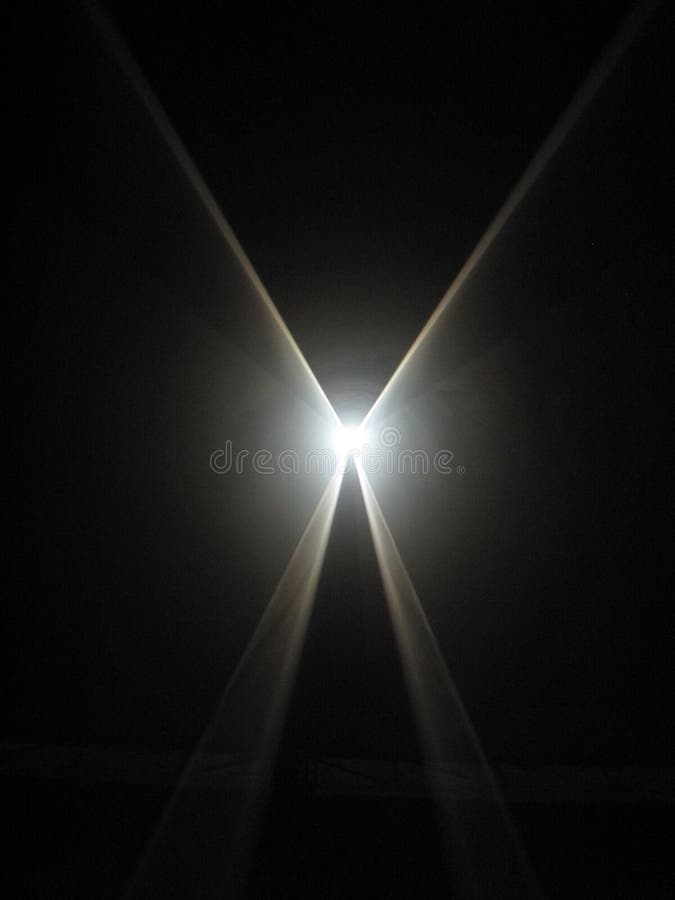 Vertical Shot of Rays of Light Wiht a Black Background Stock Photo ...