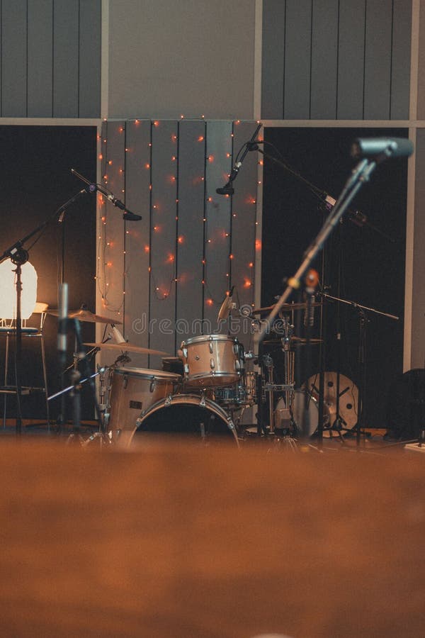 Vertical Shot of a Recording Studio with a Drum Kit and Red Lights in ...