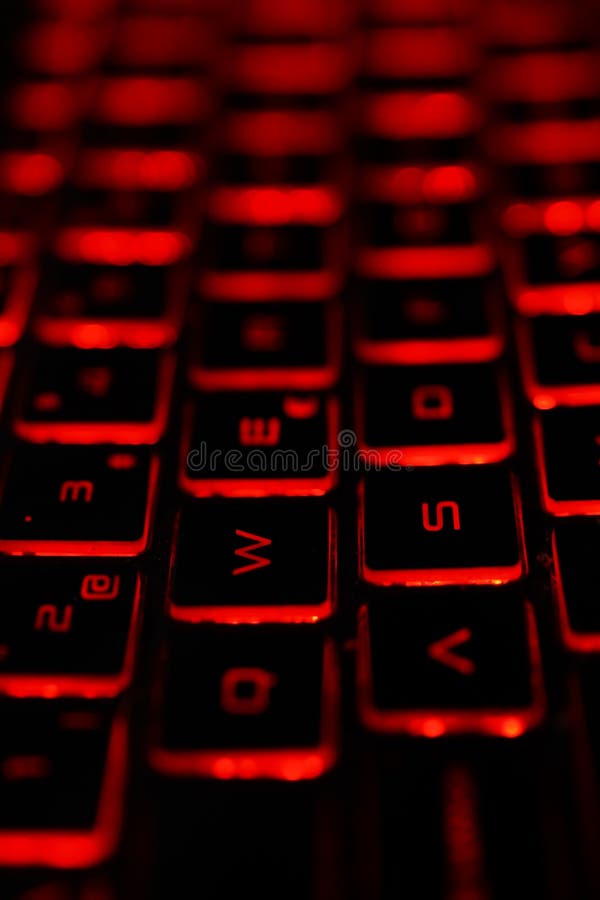 Vertical Shot of a Red, Backlit Keyboard in a Dark Setting Stock Image ...