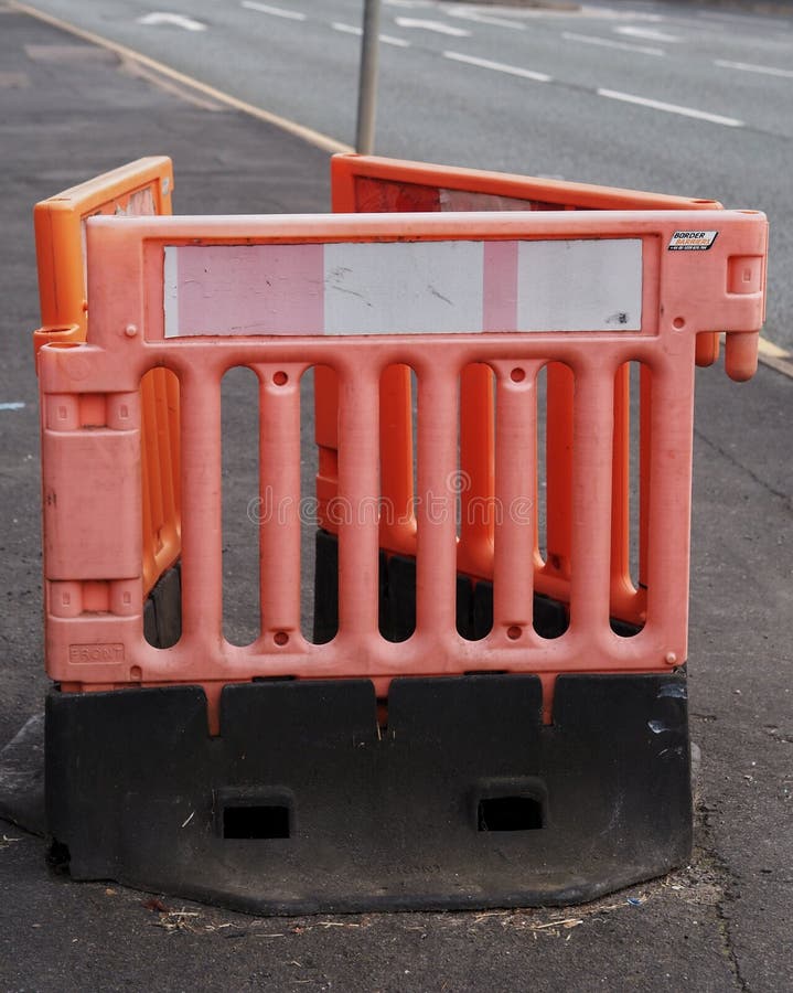 Vertical Shot of a Red Barricade on the Street Stock Photo - Image of ...