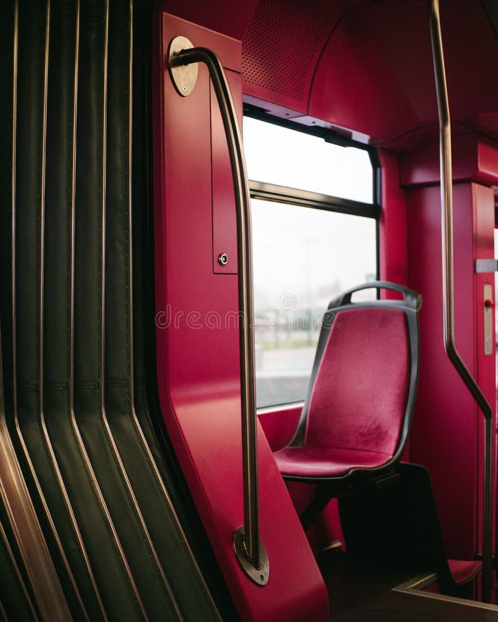 Vertical Shot of a Red Empty Seat on a Bus Stock Image - Image of ...