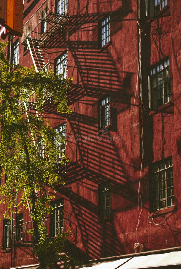 Vertical Shot of a Red House with an Emergency Staircase on the Side at ...