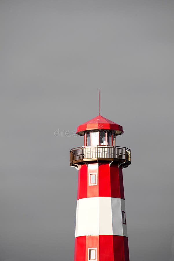 Vertical Shot of a Red Lighthouse in the Background of Grey Sky Stock ...