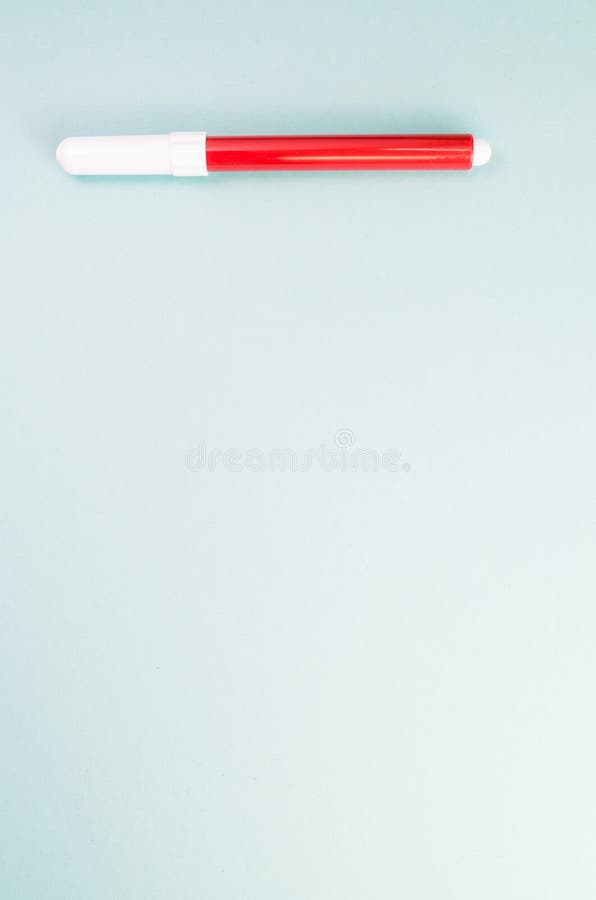 Vertical Shot of a Red Marker on a Light Blue Surface Stock Image ...