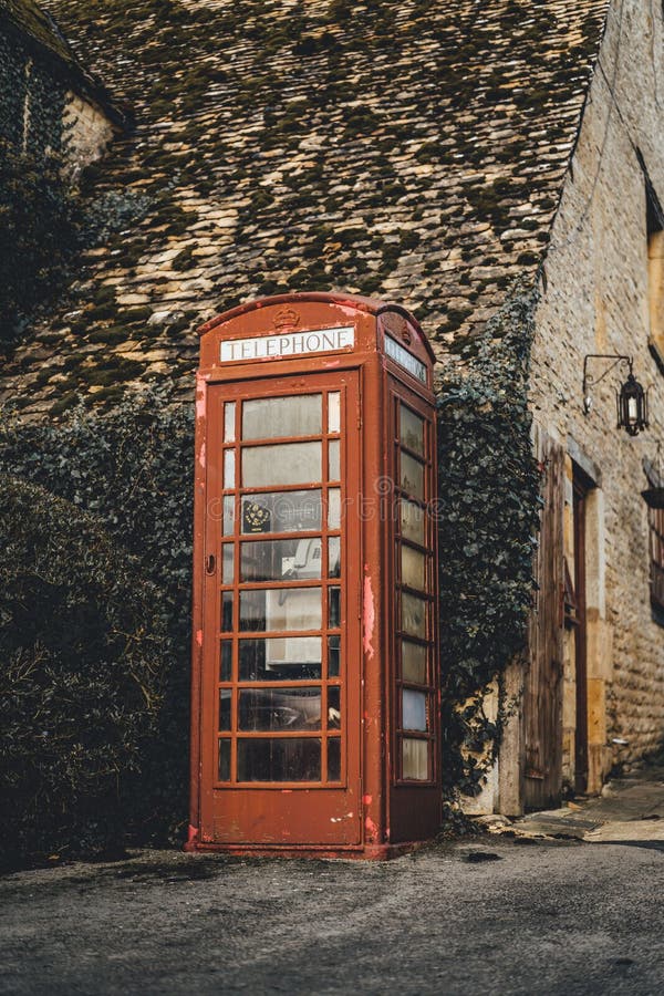 A Red Payphone Next To a Beautiful Old-style Building Stock Image ...