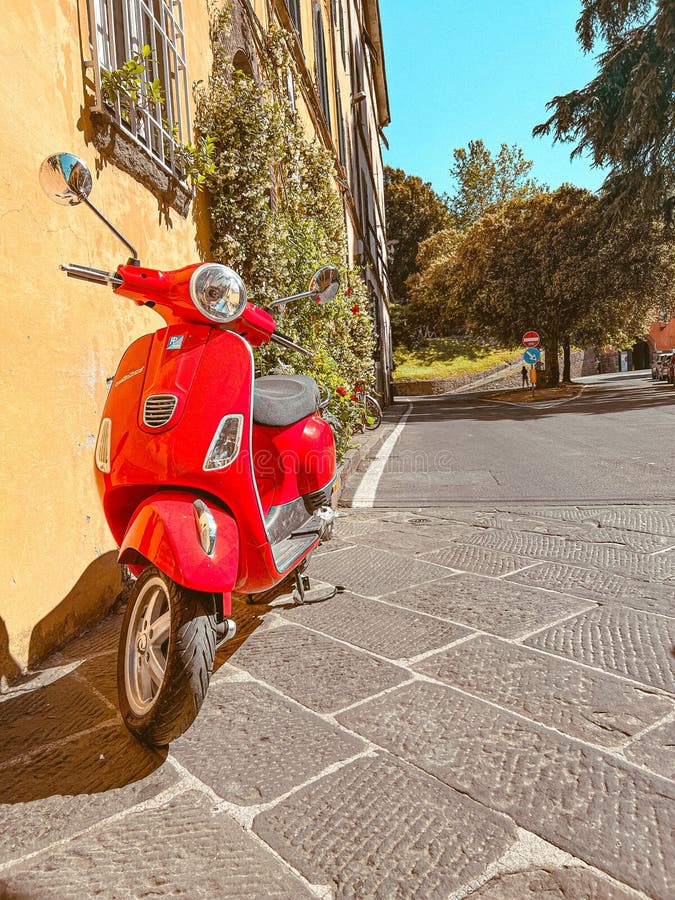 Vertical Shot of a Red Scooter in a Small Village in Italy Editorial ...