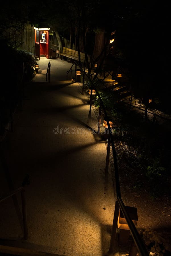 Vertical Shot of a Red Telephone Booth with Lit Lights at the Night ...