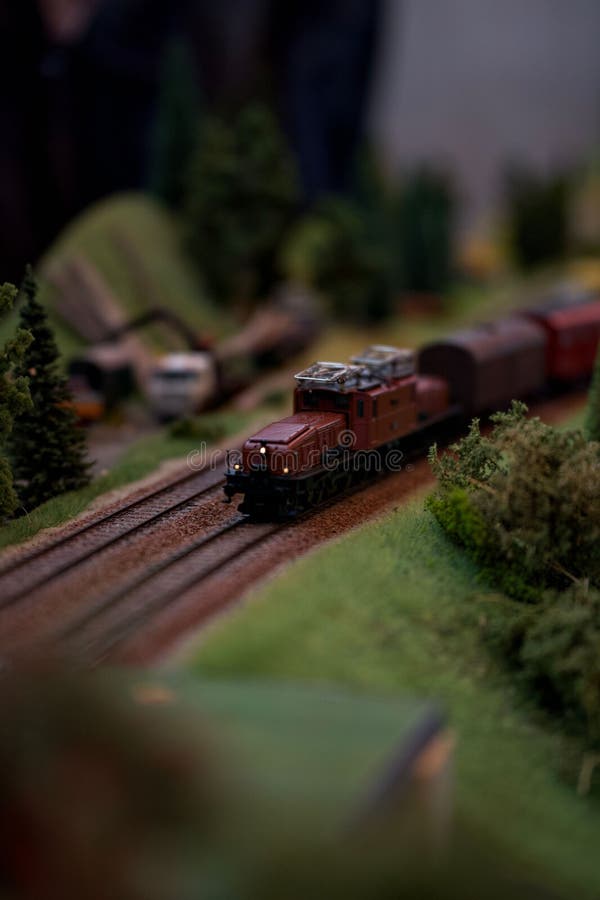 Vertical Shot of a Red Train Figure on Play Tracks Stock Photo - Image ...