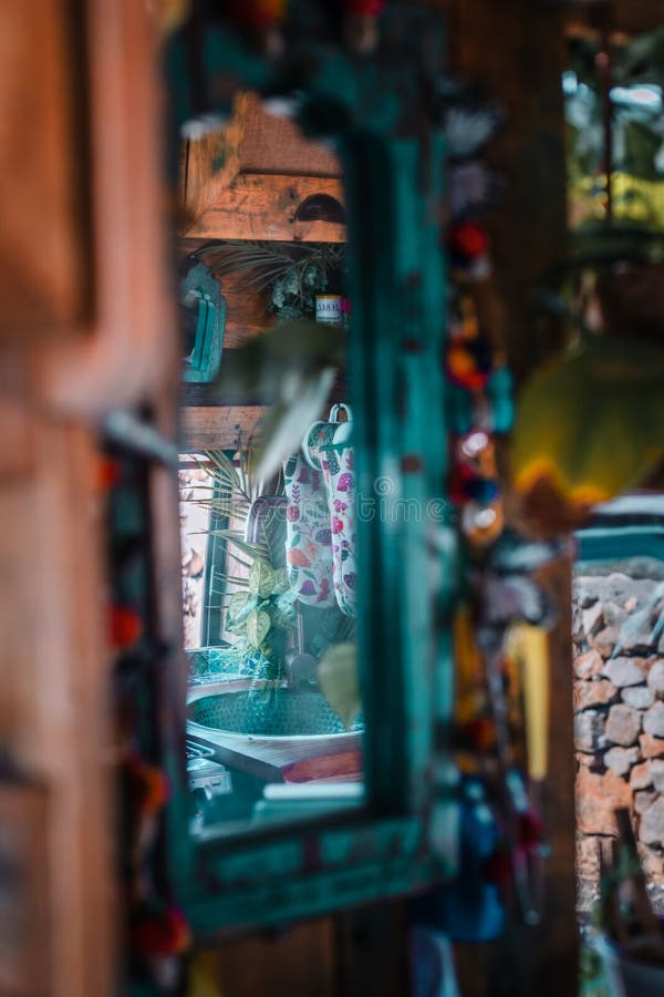 Vertical Shot of the Reflection of Rustic Kitchen Interior in the ...
