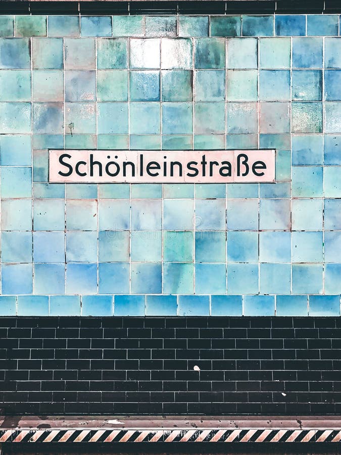 Vertical Shot of a Reflective Wall with Ceramic Tiles and a Black ...