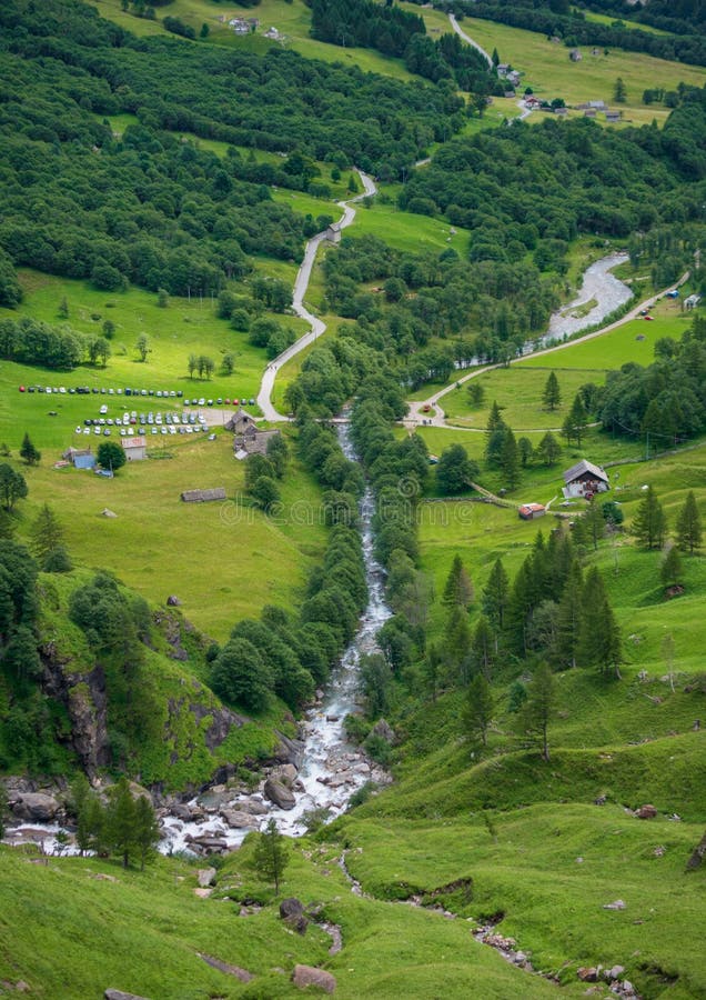 Vertical Shot of a River Running through the Greenery in North Italy ...