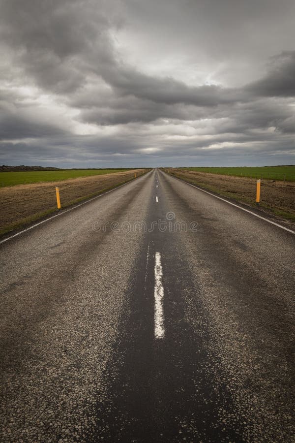 Vertical Shot of a Road Stretching through a Rolling Landscape of ...