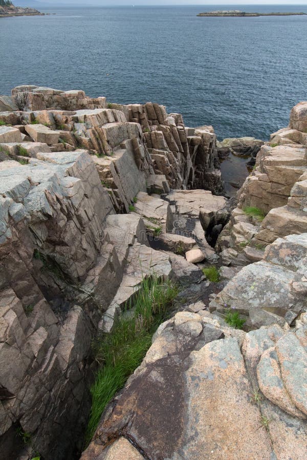 Vertical Shot of Rocks and Cliffs Surrounded by the Sea at Daytime ...