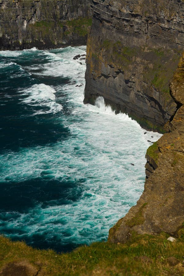 Vertical Shot of the Rocky Cliff and the Sea Stock Image - Image of ...
