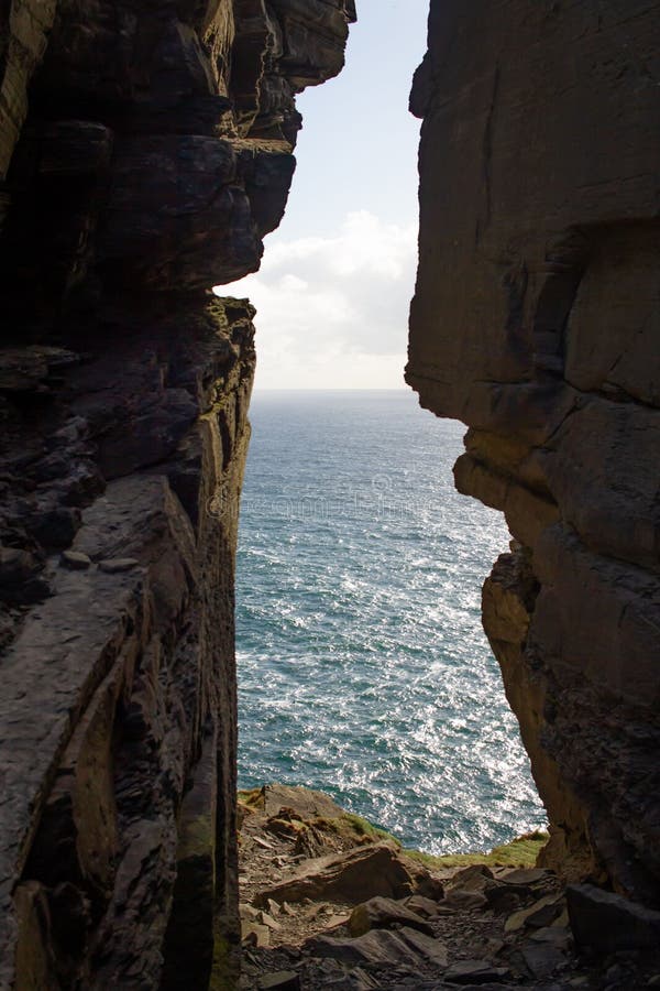 Vertical Shot of the Rocky Cliff and the Sea Stock Image - Image of ...