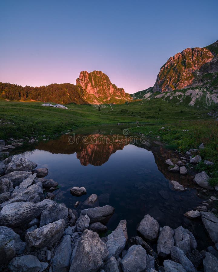 Vertical Shot of the Rocky Formations Reflected in the Small Waterbody ...