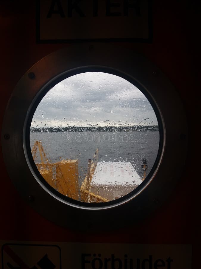 Vertical Shot of a Round Ship Window with Droplets of Rain Stock Photo ...