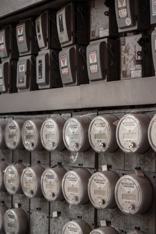 Vertical Shot of a Row of Electricity Meters Stock Photo - Image of ...