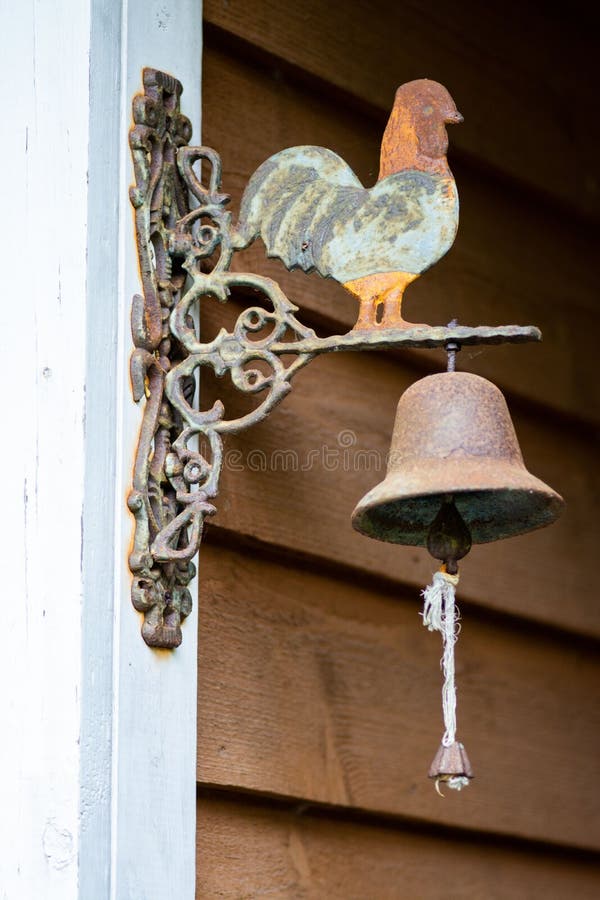 Vertical Shot of a Rustic Doorbell with a Cockerel Stock Image - Image ...