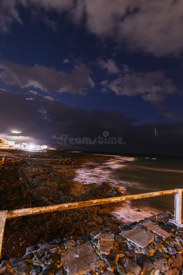 Seashore at Night stock photo. Image of light, landmark - 34499592