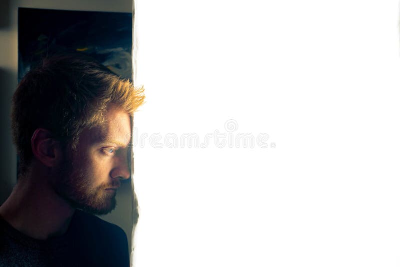 Vertical Shot of a Sad Thoughtful Ginger Man with Blue Eyes Leaning on ...