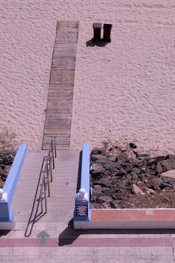 Vertical Shot of a Sandy Beach with Stairs Stock Photo - Image of ...