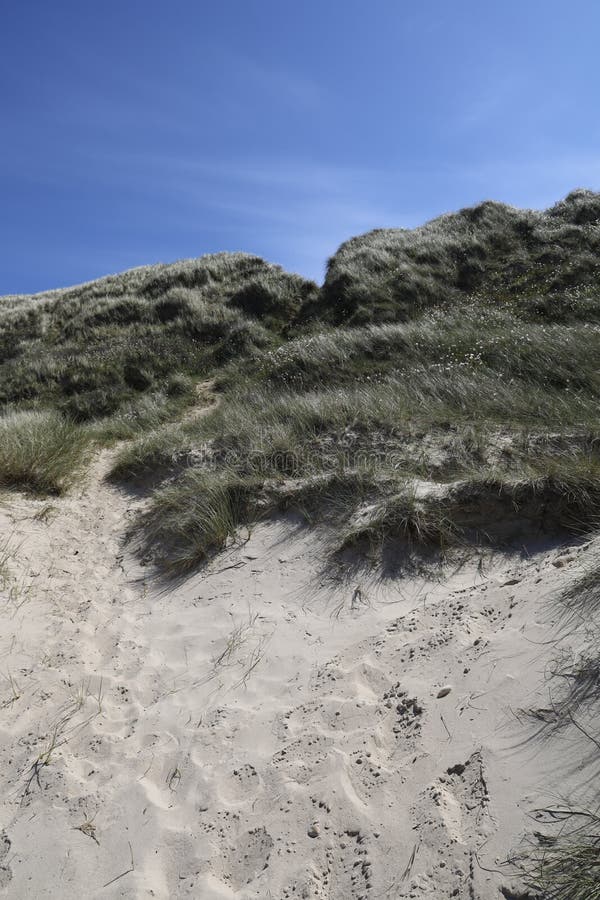 Vertical Shot of a Sandy Hill in Lonstrup, Denmark Under the Blue Sky ...