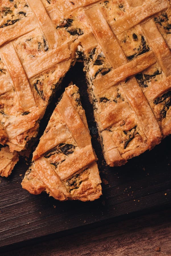 Vertical Shot of a Savory Spinach Pie with a Slice Cut Out Stock Image ...