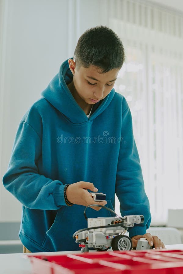 Boy Using Remote Controller Stock Photo - Image of school, classroom ...
