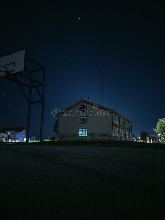 Vertical Shot of a School Building Under the Beautiful Starry Night Sky ...