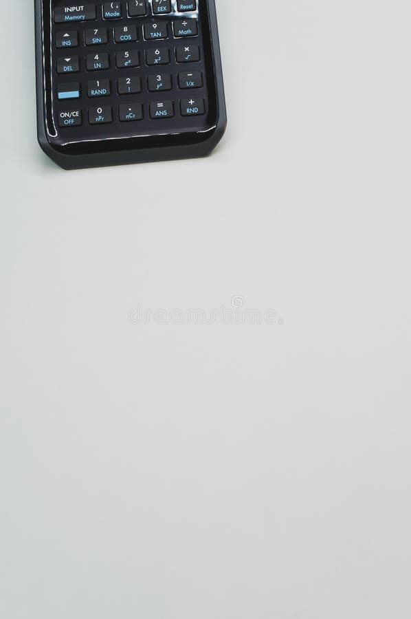 Vertical Shot of a Scientific Calculator on Pastel Gray Background with ...