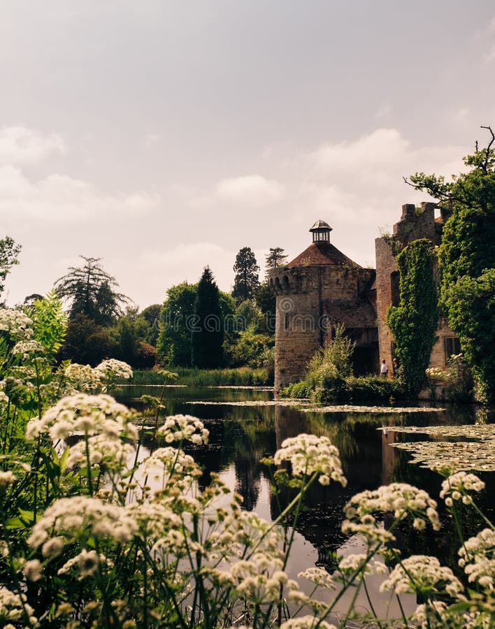 Vertical Shot of Scotney Castle in England with a Cloudy Sky in the ...