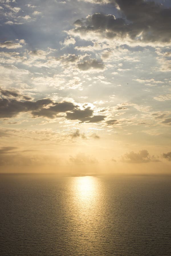 Vertical Shot of Sea and Clouds during Sunset Stock Photo - Image of ...