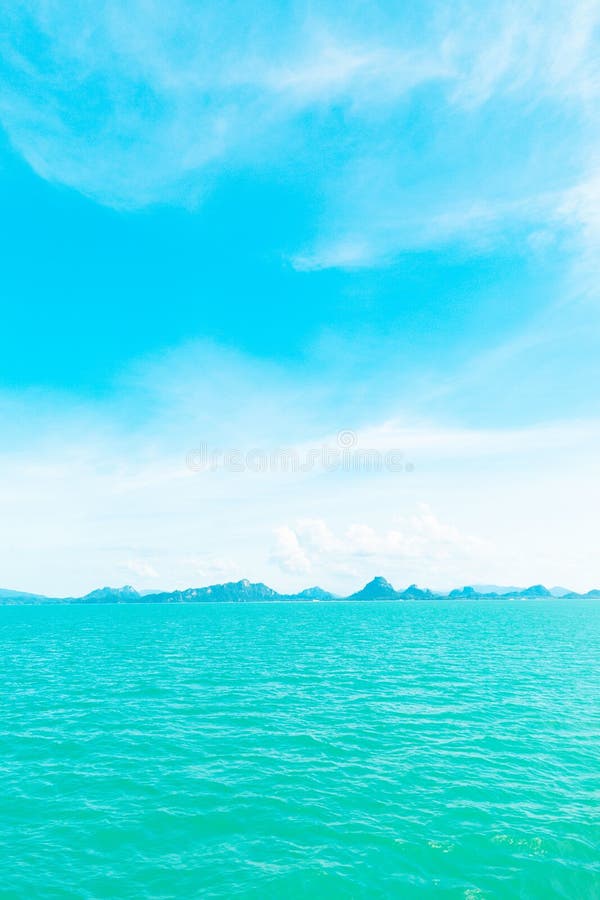 Vertical Shot of the Sea Under a Blue Sky at Daytime Stock Photo ...