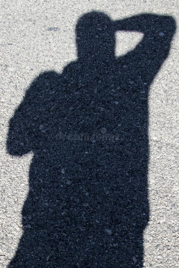 Vertical Shot of a Self Shadow of a Photographer Stock Photo - Image of ...