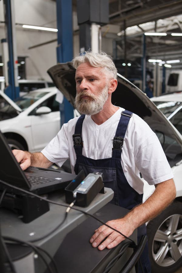 Elderly Repairman Working on a Car Stock Image - Image of mechanic ...