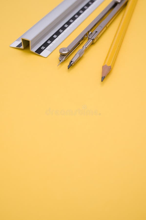 Vertical Shot of a Set of Technical Drawing Tools on a Yellow ...