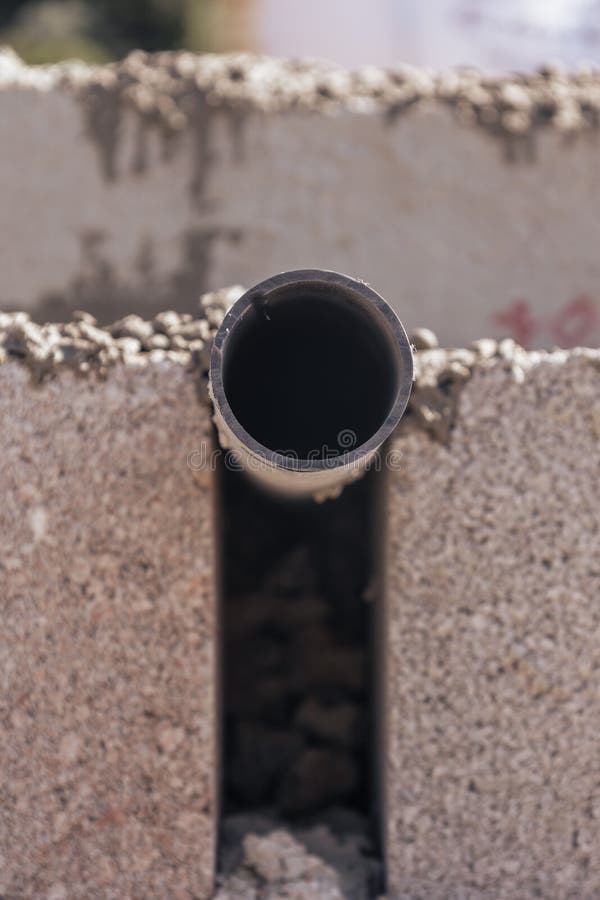 Vertical Shot of a Sewer Pipe Being Built Under Ground Stock Image ...