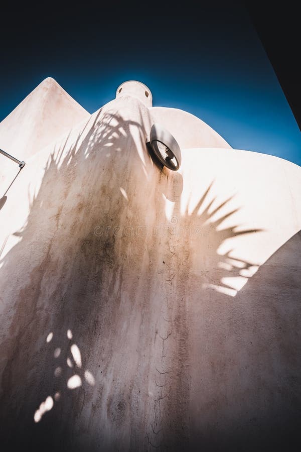 Vertical Shot of Shadows on an Aged White Building Stock Photo - Image ...