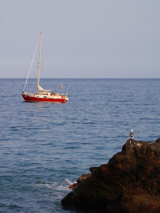 Vertical Shot of a Ship Sailing on the Mild Ocean Waves Stock Image ...