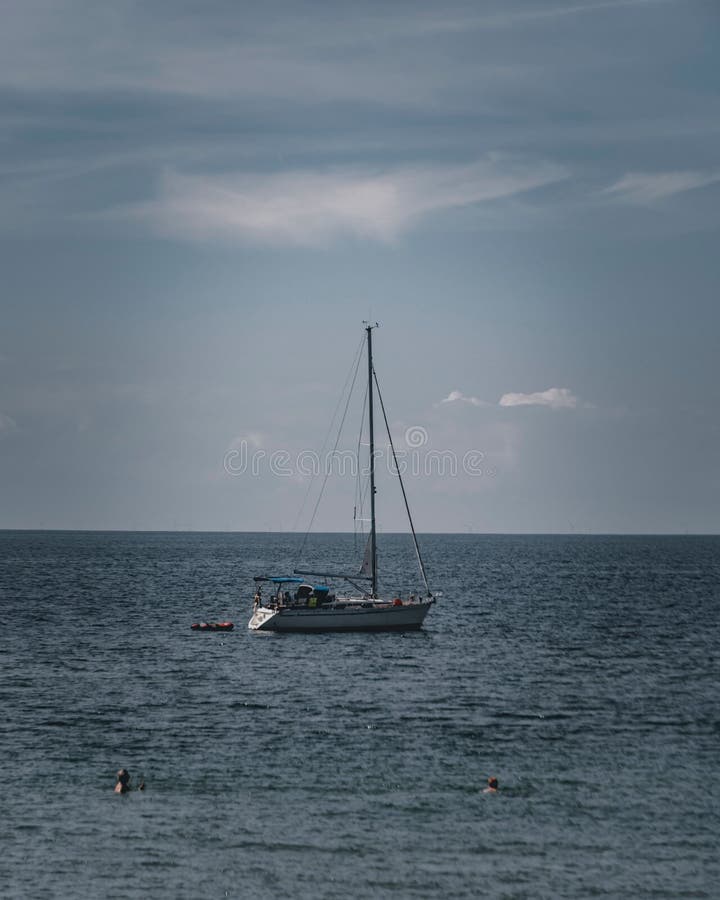 Vertical Shot of a Ship Sailing in the Sea Stock Image - Image of ship ...