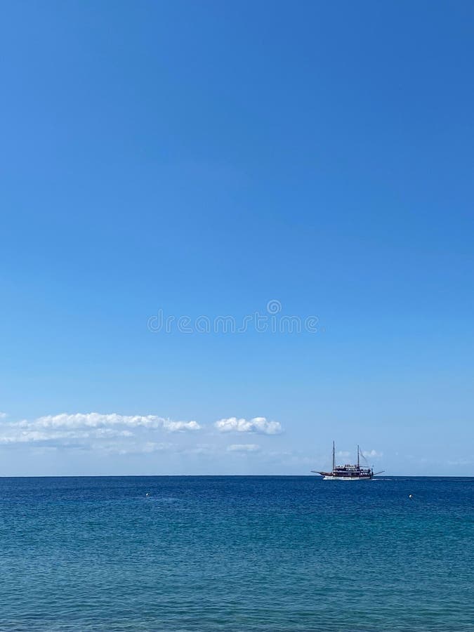 Vertical Shot of a Ship in the Sea Stock Image - Image of ship, vessel ...