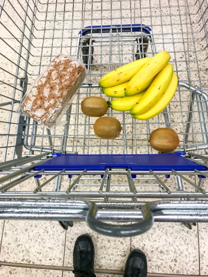 Vertical Shot of a Shopping Cart with Bread Kiwis and Bananas Stock ...