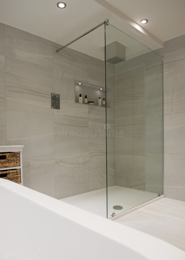 Vertical Shot of a Shower Cabin in an Elegant Modern Bathroom with Soft ...